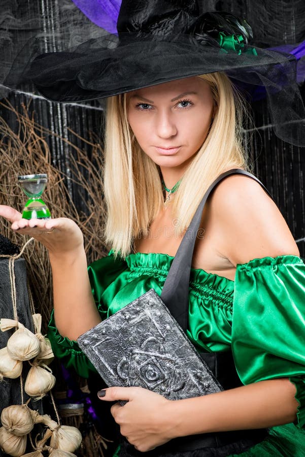 Vertical Portrait of a Beautiful Witch with a Magic Book Stock Image ...