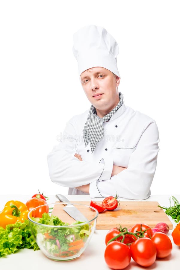 Vertical Portrait of a Cook at the Table with Vegetables on a White ...