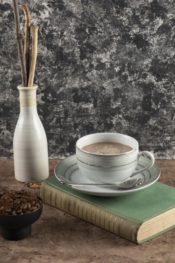 Vertical Portrait of a Cup of Coffee on a Table with a Book and Coffee ...
