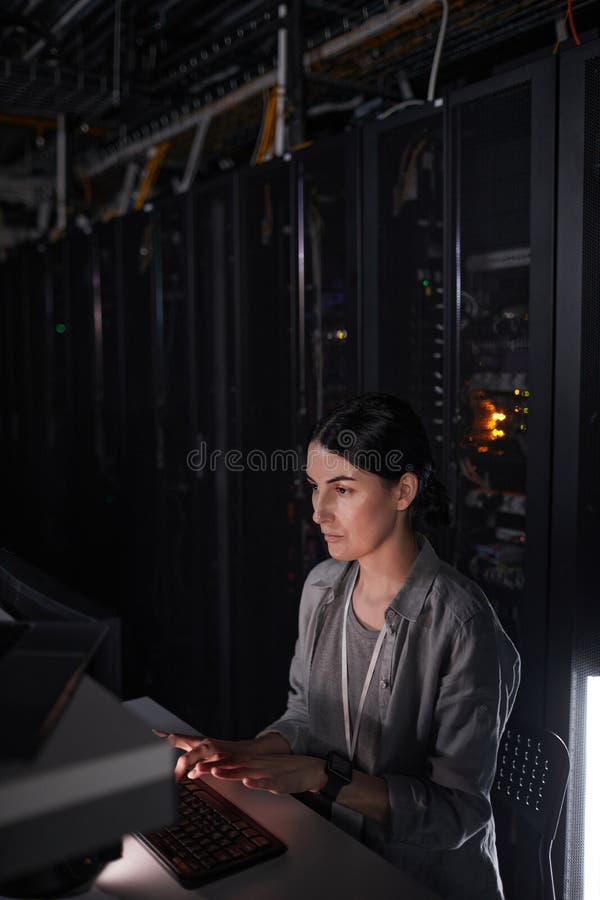Young Woman Using Computer in Server Room Stock Photo - Image of woman ...