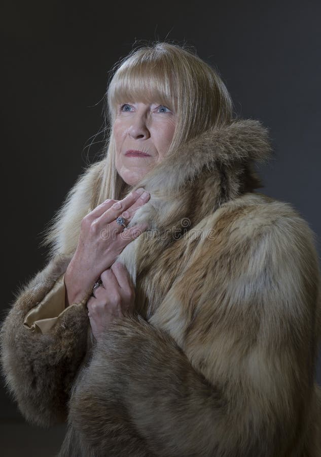 Mature woman in a fur coat stock image. Image of vintage - 101872225