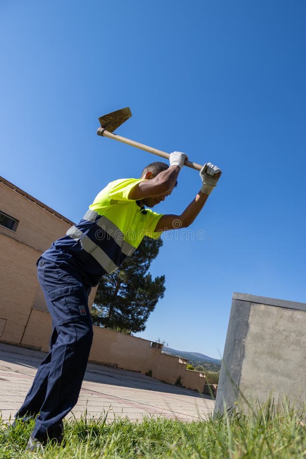 Vertical Portrait of Latin Worker Dressed in Work Clothes Digging the ...