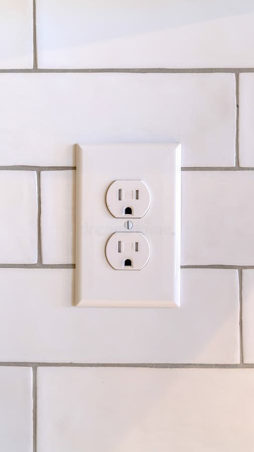 Vertical Power Outlet on White Wall in Home Stock Photo - Image of ...