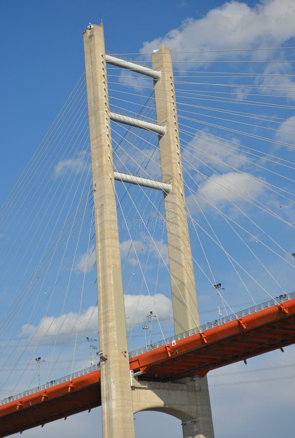 The Vertical Pylon and Diagonal Struts of a Bridge Against a Blue Sky ...
