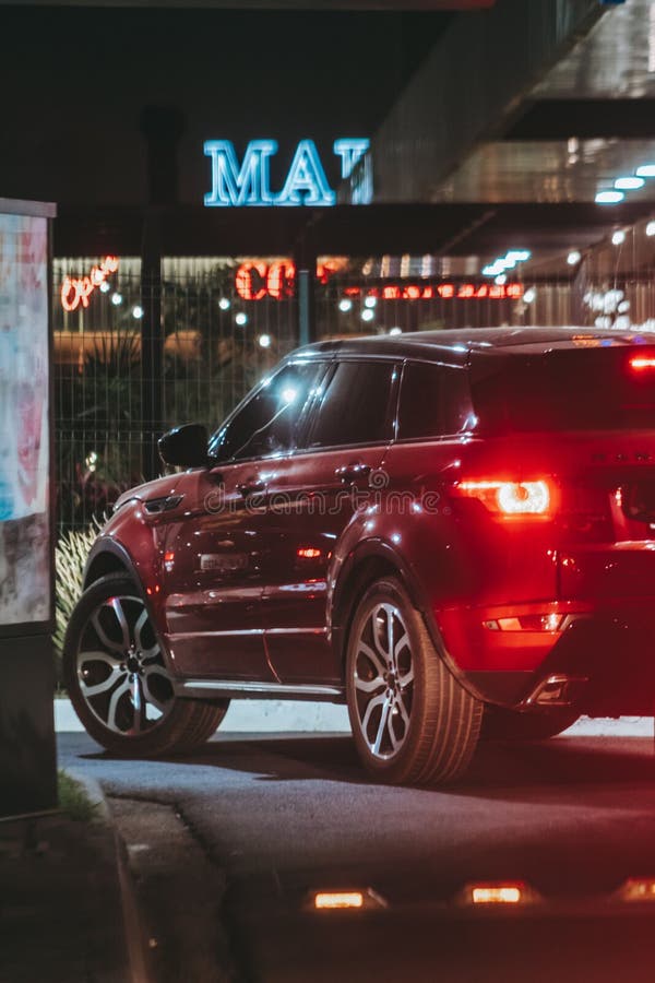 Vertical of a Red Range Rover at the Night City Editorial Photo - Image ...