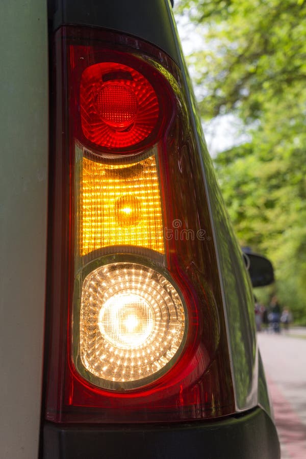 Red Taillight on Yellow Car. Backlight of Modern Sport Car. Four Wheels ...