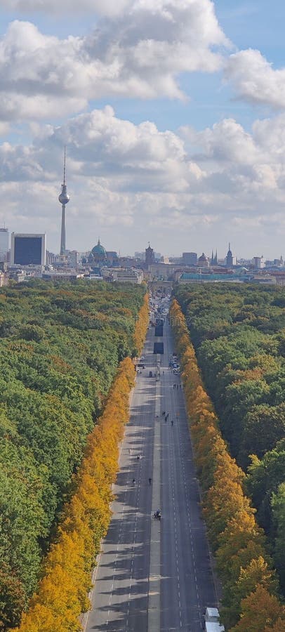 Vertical of a Road Alongside the Green and Yellow Trees with Berlin ...