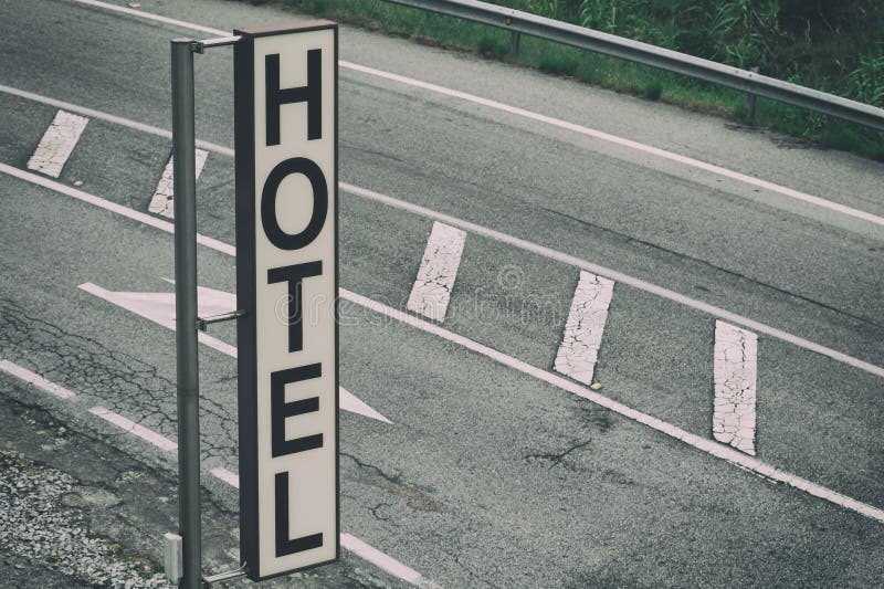 Vertical road hotel sign stock image. Image of asphalt - 144378829