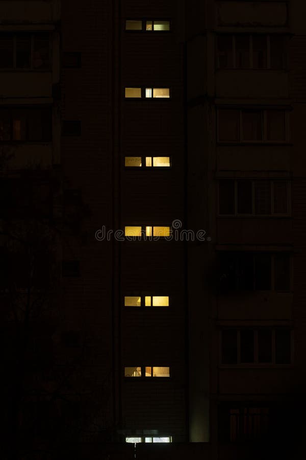 A Vertical Row of Narrow Rectangular Windows of a High-rise Residential ...