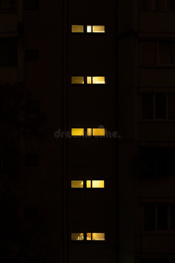 A Vertical Row of Narrow Rectangular Windows of a High-rise Residential ...