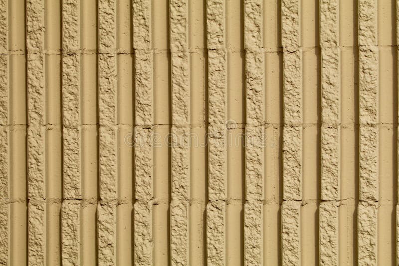 Vertical Rows in a Tan Concrete Wall in the Bright Light Stock Image ...