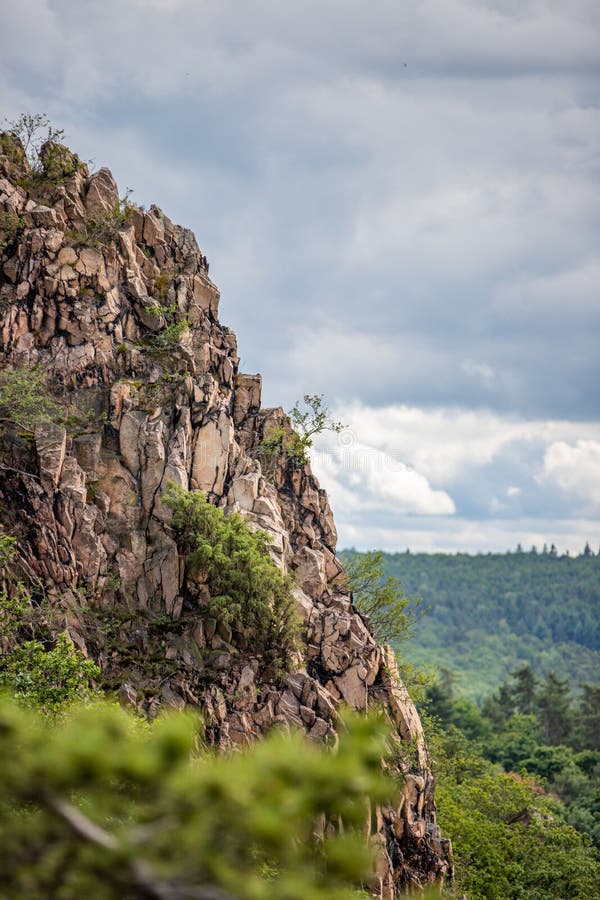 Vertical of a Rugged Cliff, Cascade of Rock Formations Captured Against ...
