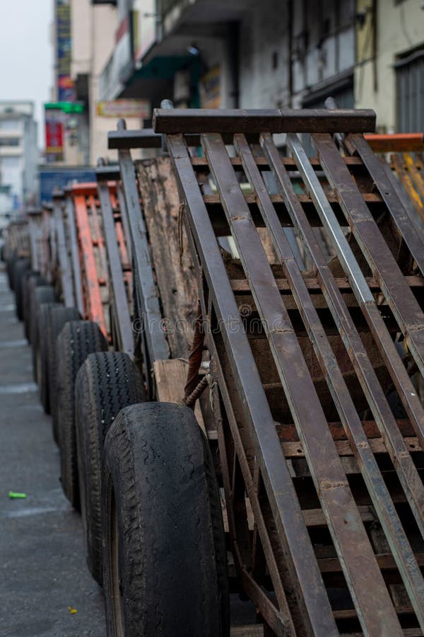 Vertical of Rusty Cargo Carriers Parked on a City Street Stock Photo ...
