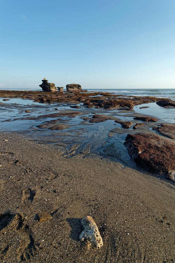 Vertical of a Sand Beach with Shallow Water and Cliffs in the Sea Stock ...