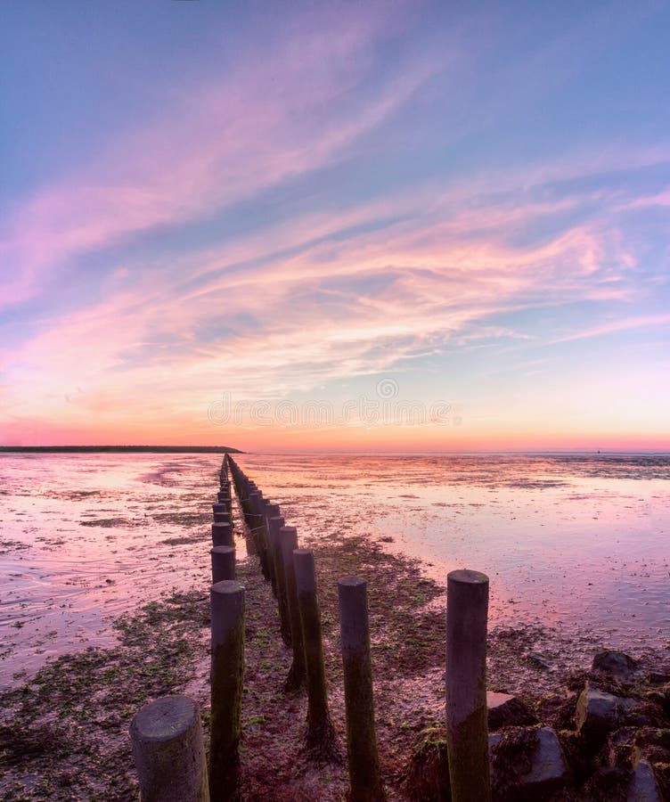 Vertical Scenic Shot of the Sea during Sunset Under the Sky and ...