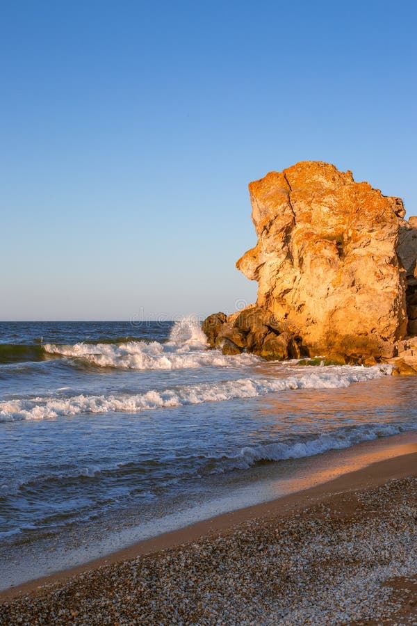 Vertical Seascape. a Stone Cliff on the Seashore with a Sandy Beach is ...