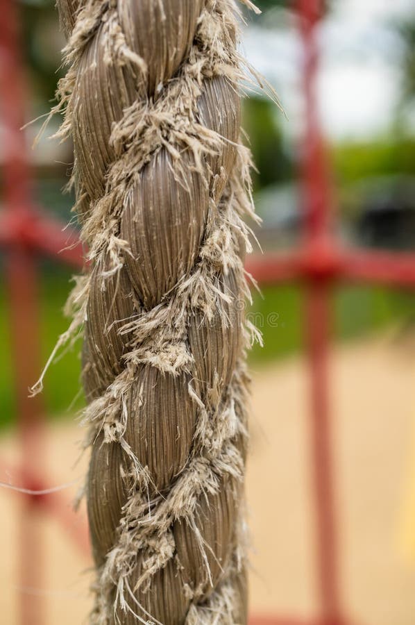 Vertical Selective Focus Shot of a Damaged Rope in the Playground Stock ...