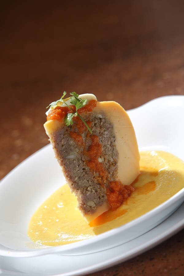 Vertical Selective Focus Shot of Edam Cheese with Beef Stew, Tomato ...