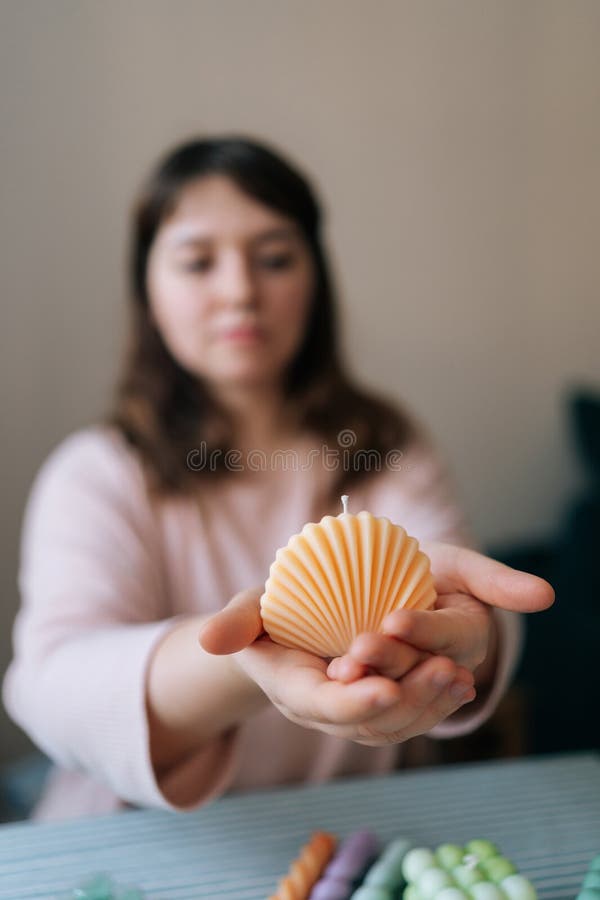 Vertical Selective Focus Shot of Female Artisan Craftperson Holding in ...