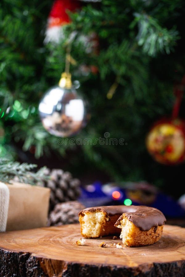 Vertical Selective Focus Shot of Half Bitten Doughnut with a Decorated ...