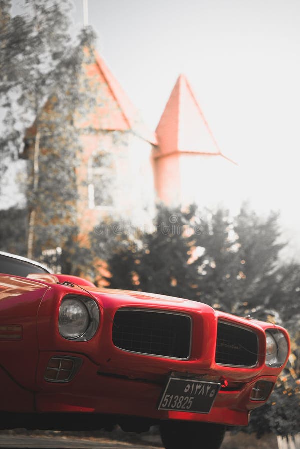 Vertical Selective Front View of an American Red Pontiac Firebird with ...