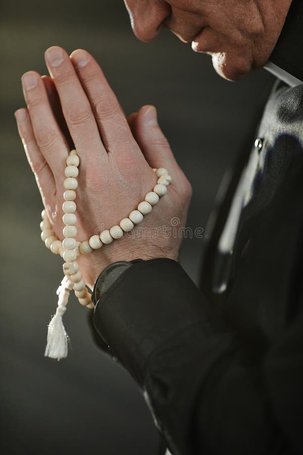 Vertical Senior Priest with Hands Clasped in Prayer and Rosary Stock ...