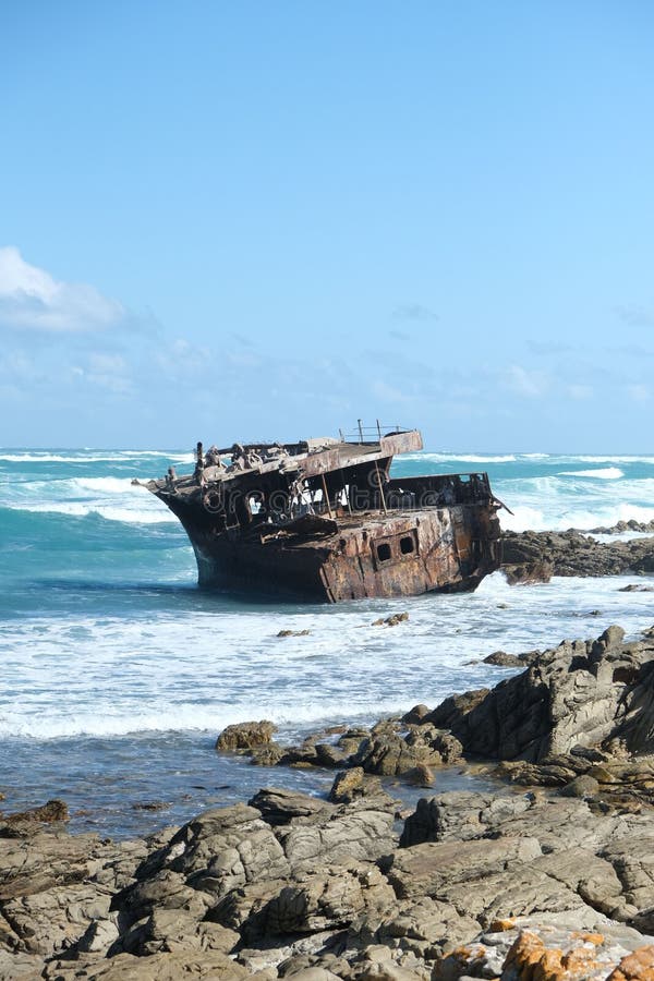 Vertical of a Shipwreck in Seascape Coastline Hulk of a Cargo Ship ...
