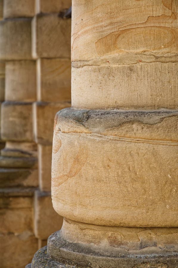 Vertical Shot of Aged Columns Built into the Stone Wall Stock Image ...