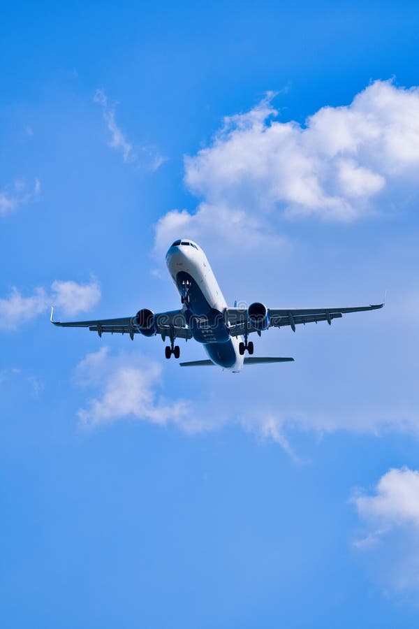 Vertical Shot of an Airplane Flying Overhead Editorial Stock Photo ...