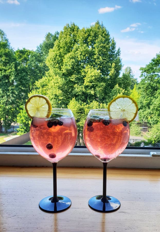 Vertical Shot of an Alcoholic Drink in a Wineglass with Lemon on the ...