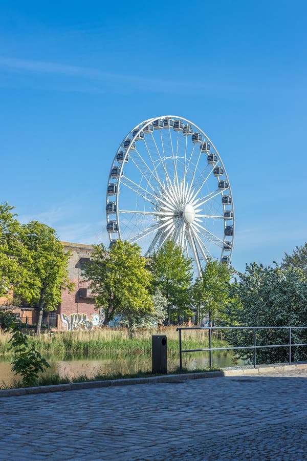 Vertical Shot of an Amber Sky Wheel in Gdansk Editorial Photography ...