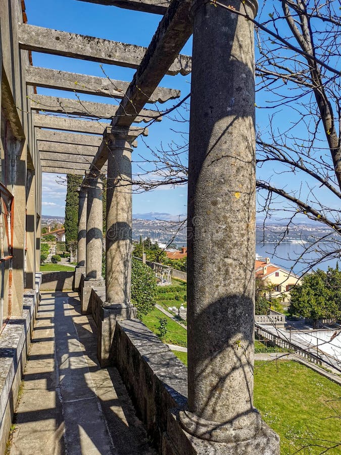 Vertical Shot of an Ancient Building with Columns on the Blue Sky ...