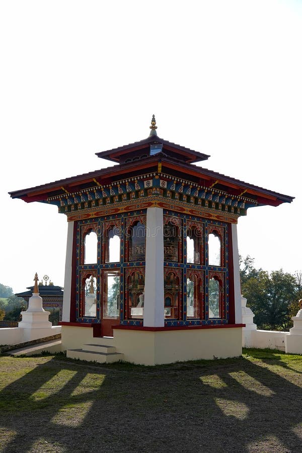 Vertical Shot of an Asian Temple Surrounded by Meadow and Sunlight ...