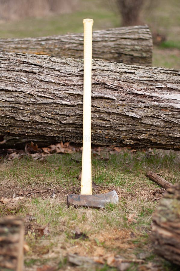 Vertical Shot of an Ax on a Piece of Wood Stock Image - Image of ...