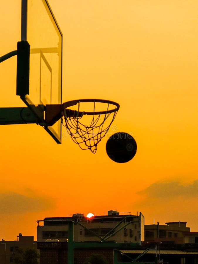 Vertical Shot of a Basketball Net during the Sunset Stock Photo - Image ...