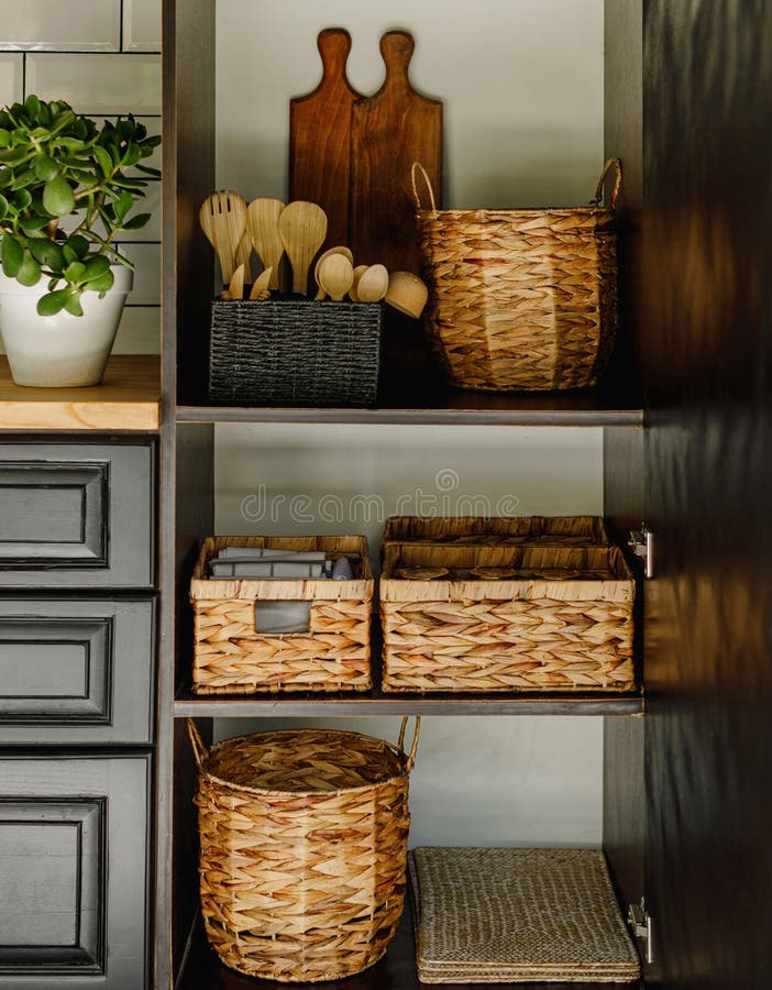 Vertical Shot of Baskets and Wooden Kitchen Utensils Organized in a ...