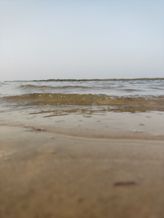 Vertical Shot from the Beach of the Sea Waves and the Sky Stock Image ... Vertical Shot from the Beach of the Sea Waves and the Sky Stock Image ...