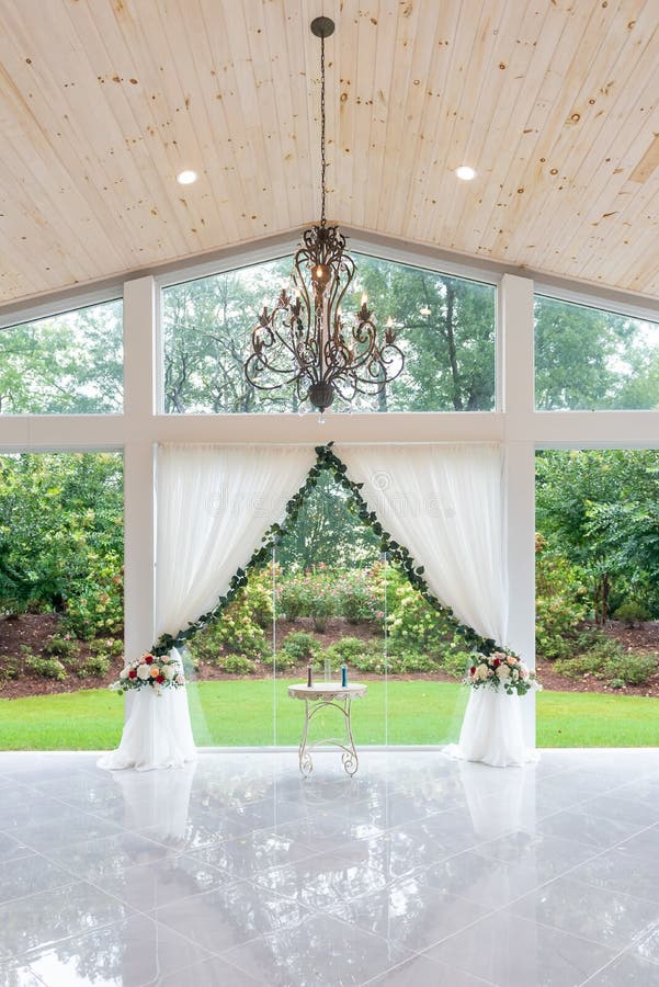 Vertical Shot of the Beautiful Altar Decorated with White Curtains in a ...