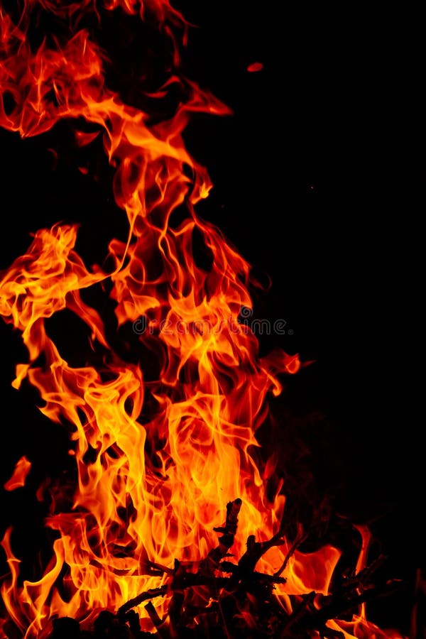 Vertical Shot Of A Beautiful Burning Fire At Night Stock Photo - Image ...