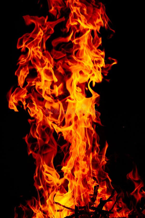 Vertical Shot of a Beautiful Burning Fire at Night Stock Photo - Image ...
