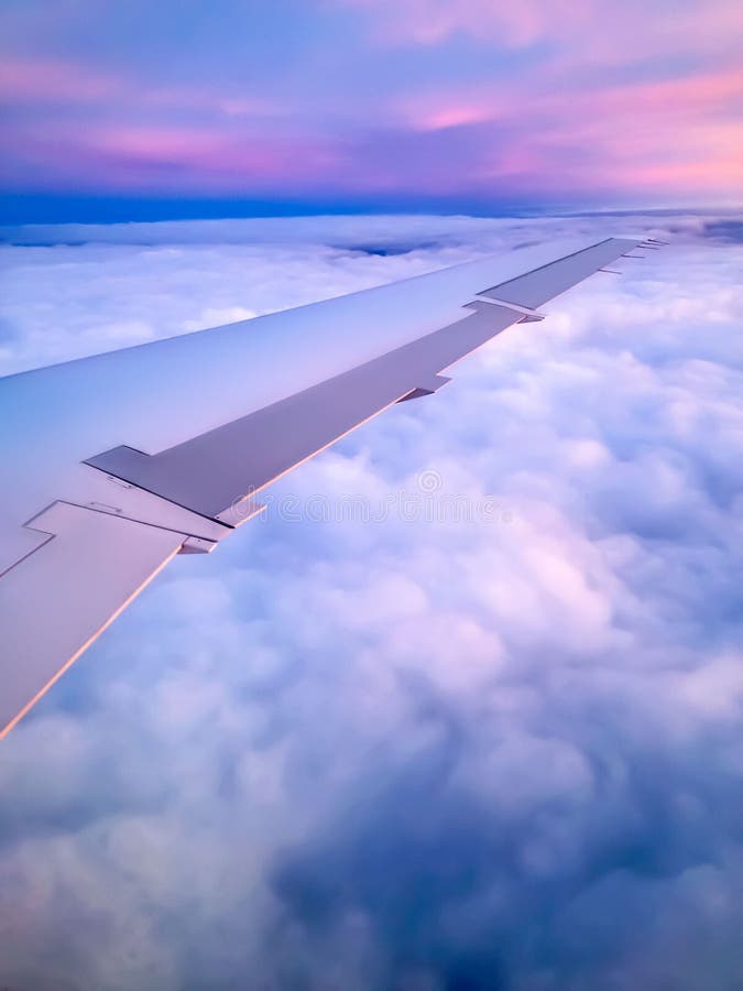 Vertical Shot of a Beautiful Cloudscape Seen from a Plane Window with a ...