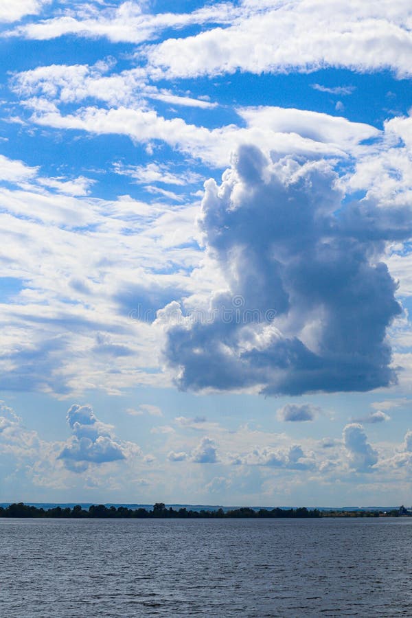 Vertical Shot of Beautiful Cumulus Clouds Over the River, Summer ...
