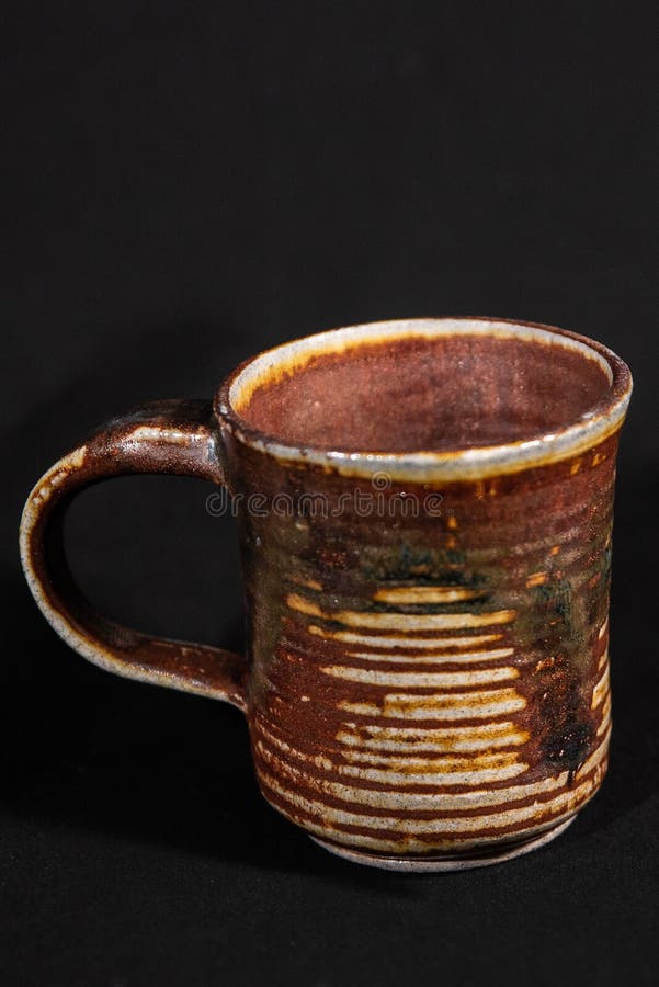 Vertical Shot of a Beautiful Handmade Mug on a Dark Background Stock ...