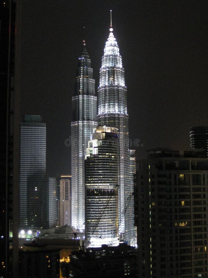 Vertical Shot of Beautiful Lighted Towers and Buildings at Night Stock ...