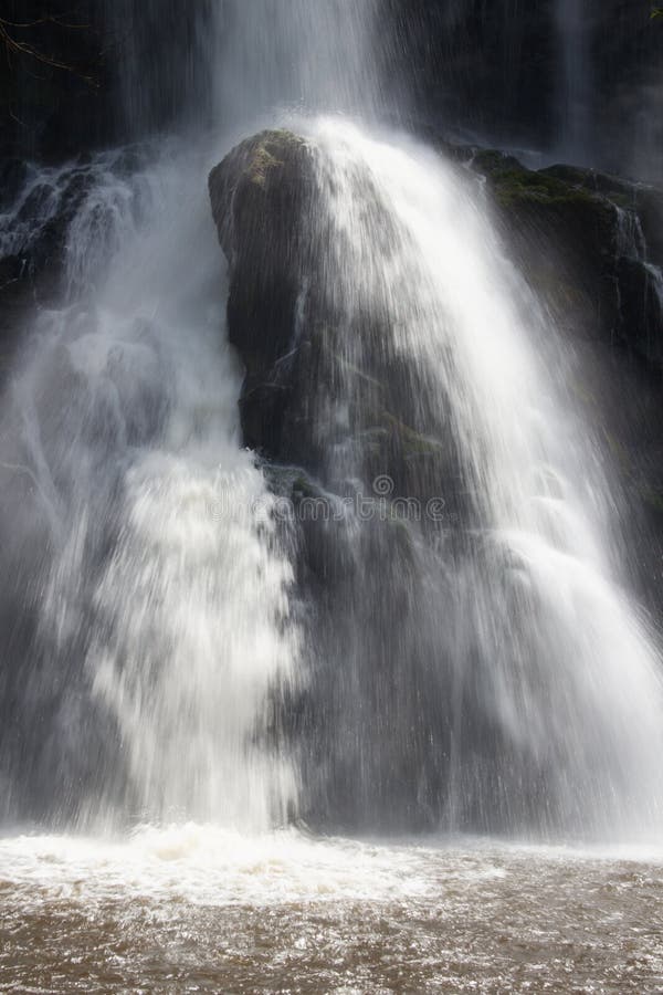 Vertical Shot of a Beautiful Natural Waterfall on a Sunny Day Stock ...