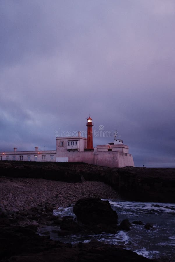 Vertical Shot of a Beautiful Scenery of Lighthouse after Sunset with ...