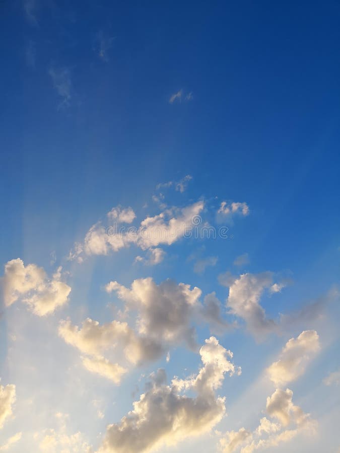Vertical Shot of a Beautiful Sky with Clouds and Sun Rays Stock Photo ...