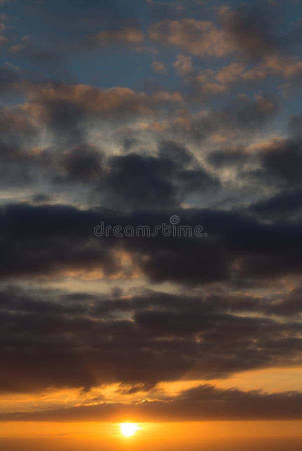 Vertical Shot of a Beautiful Sunset Scenery N the Cloudy Sky Stock ...