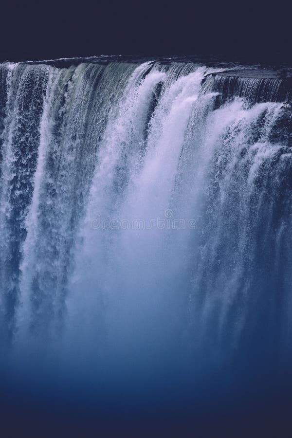 Vertical Shot of a Beautiful Waterfall Flowing Down Stock Photo - Image ...