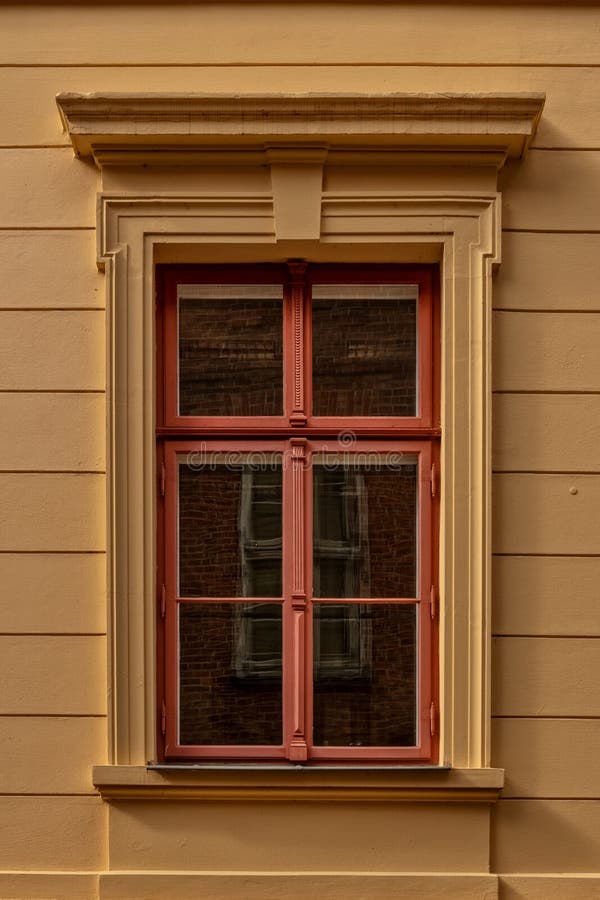 Vertical Shot of a Beautiful Window with Red Frames Inside Beige ...